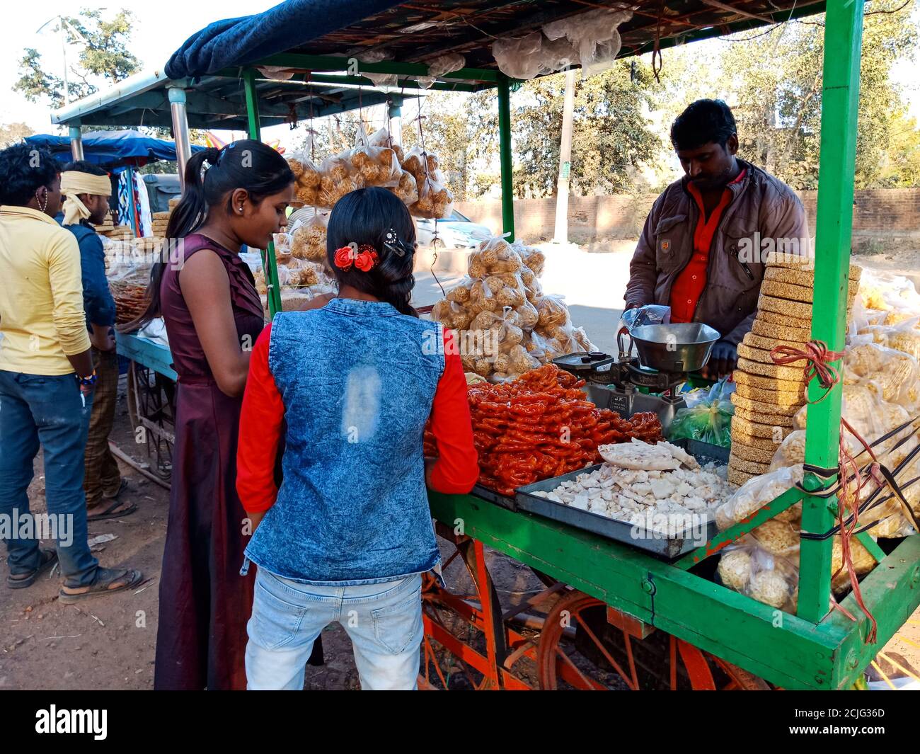 DISTRICT KATNI, INDIA - FEBRUARY 02, 2020: Two indian girl buying ...