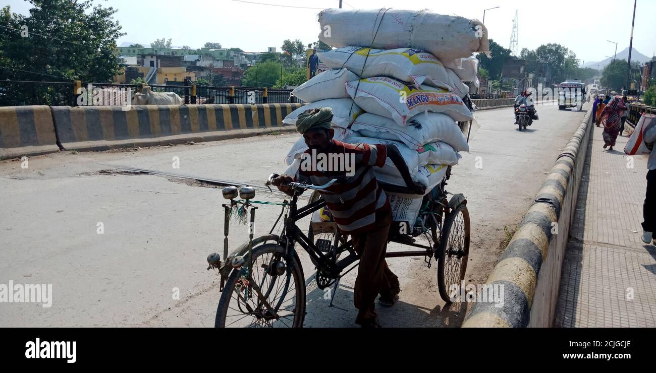 DISTRICT KATNI, INDIA - SEPTEMBER 05, 2019: An asian labour pulling ...