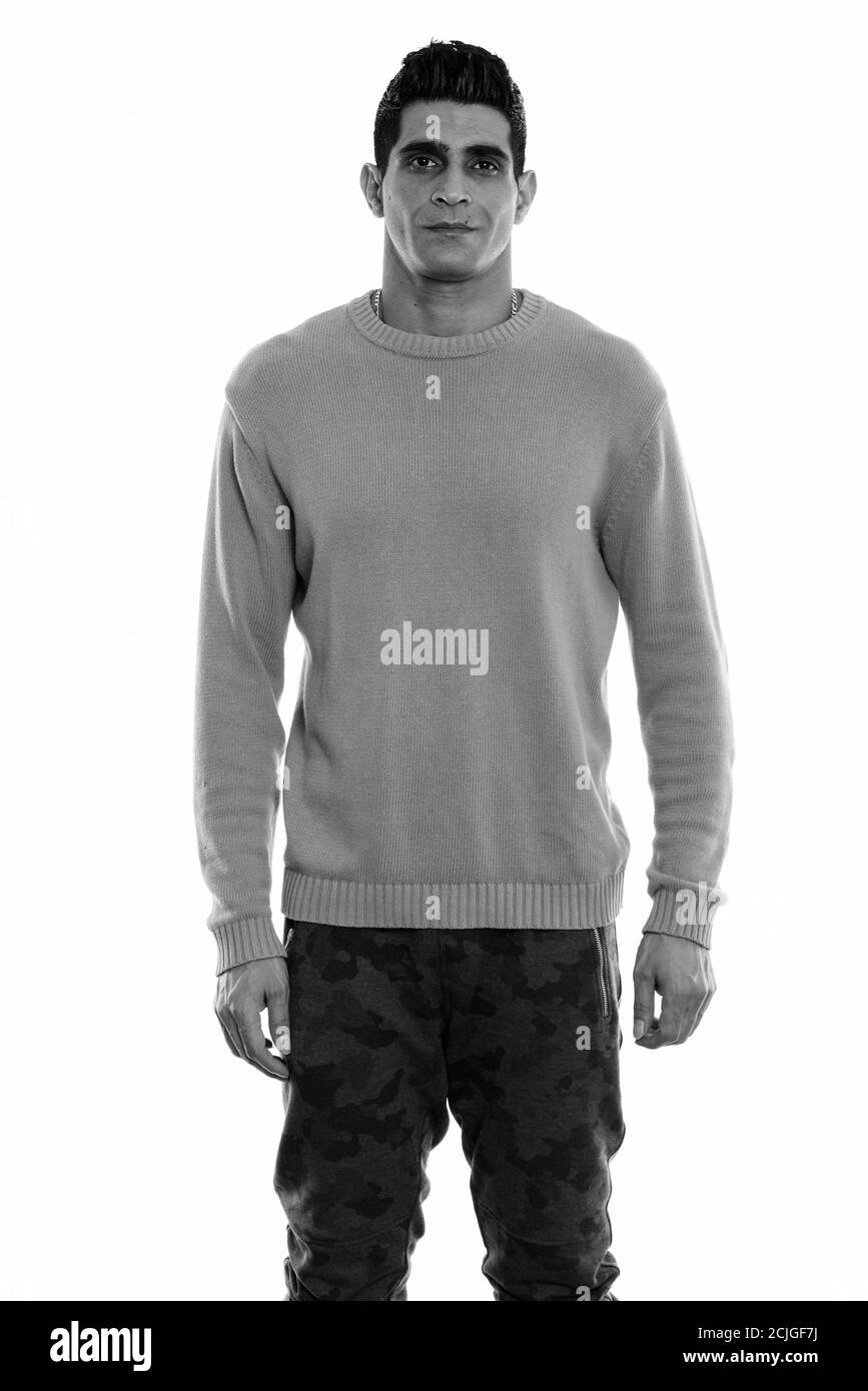 Studio shot of young muscular Persian man standing Stock Photo - Alamy