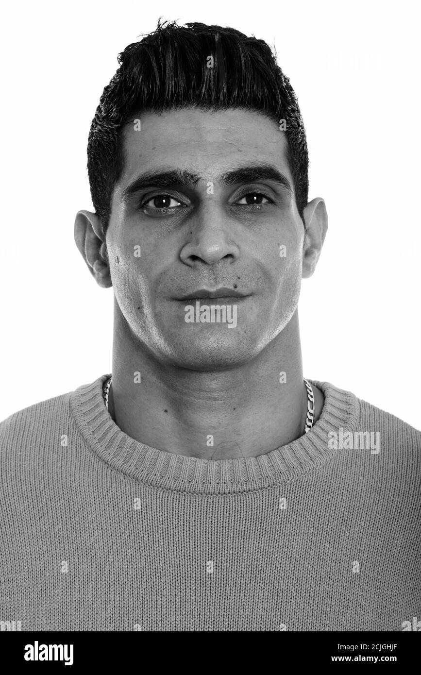 Face of young Persian man looking at camera Stock Photo - Alamy