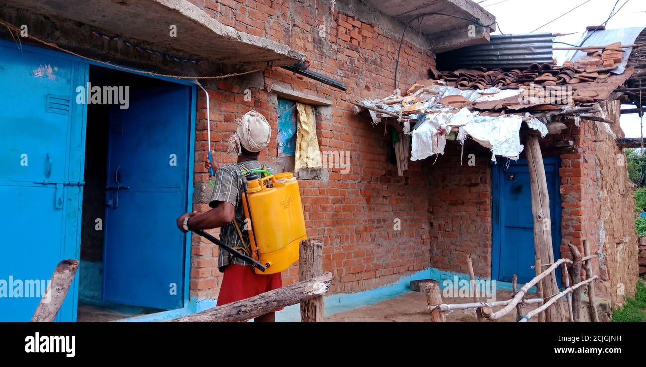DISTRICT KATNI, INDIA - AUGUST 06, 2019: An indian village man spraying ...