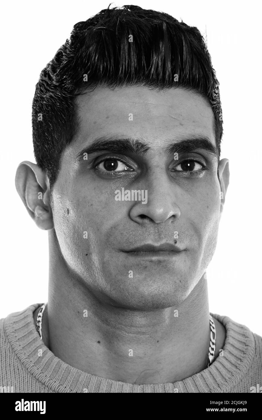 Face of young Persian man looking at camera Stock Photo - Alamy