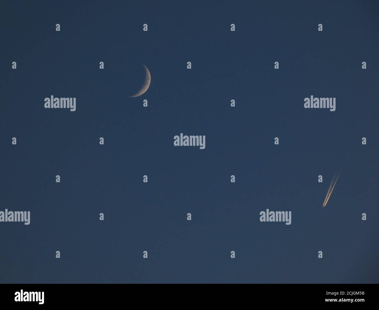 Crescent moon over cloudless clear sky Stock Photo - Alamy