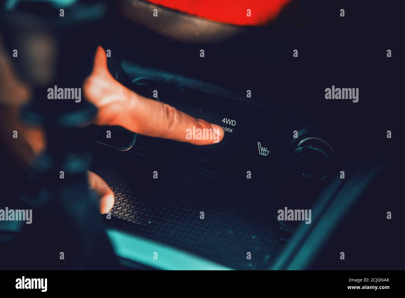 Close up of a man activating 4WD lock on a modern SUV Stock Photo - Alamy