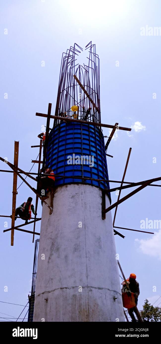 DISTRICT KATNI, INDIA - JULY 16, 2019: Indian road construction worker ...