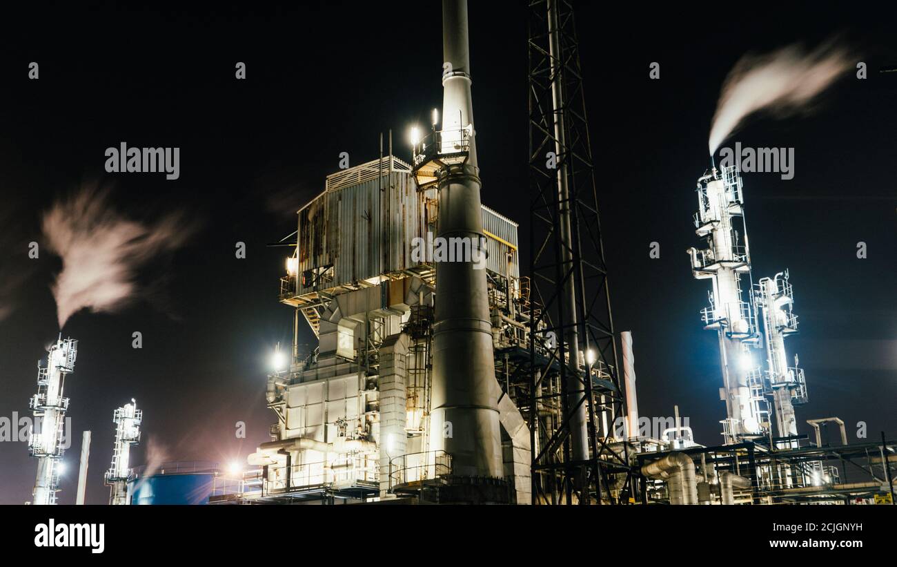 Beautiful shot of an oil refinery with light at night Stock Photo - Alamy