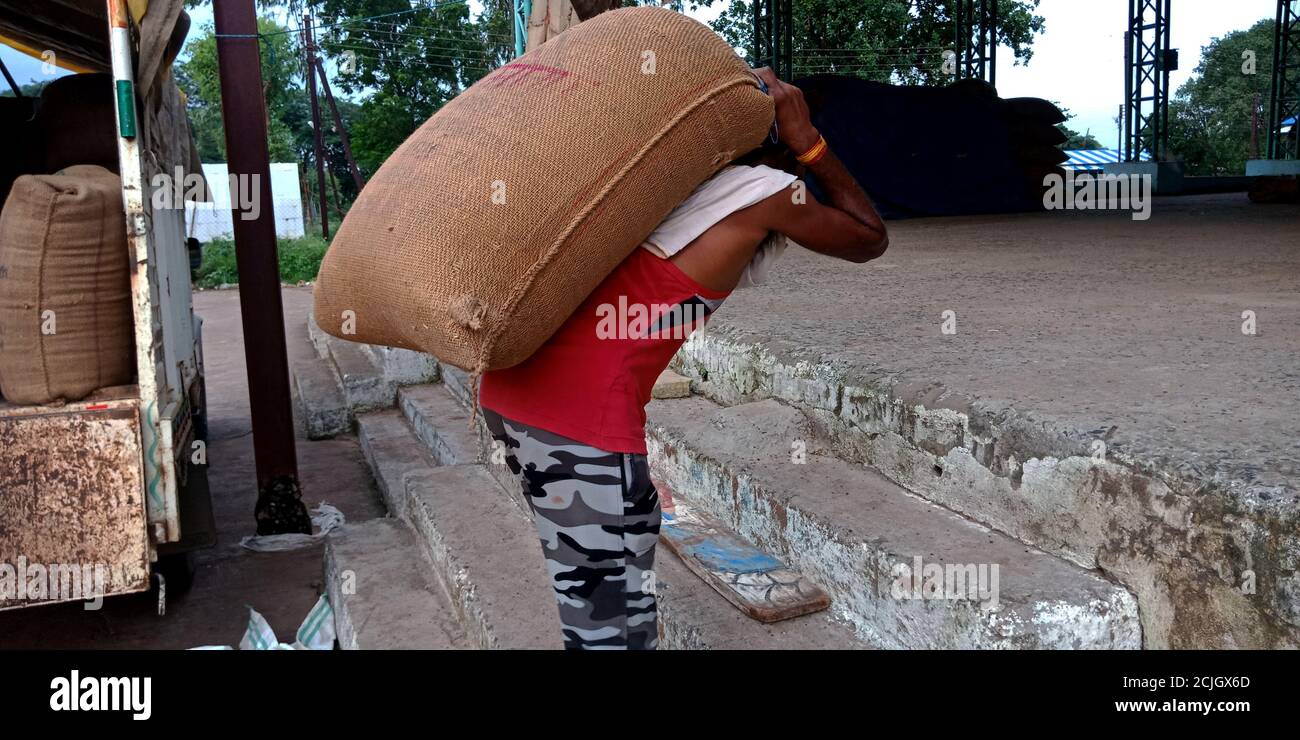 Man Carrying Sack On His Back High Resolution Stock Photography and ...