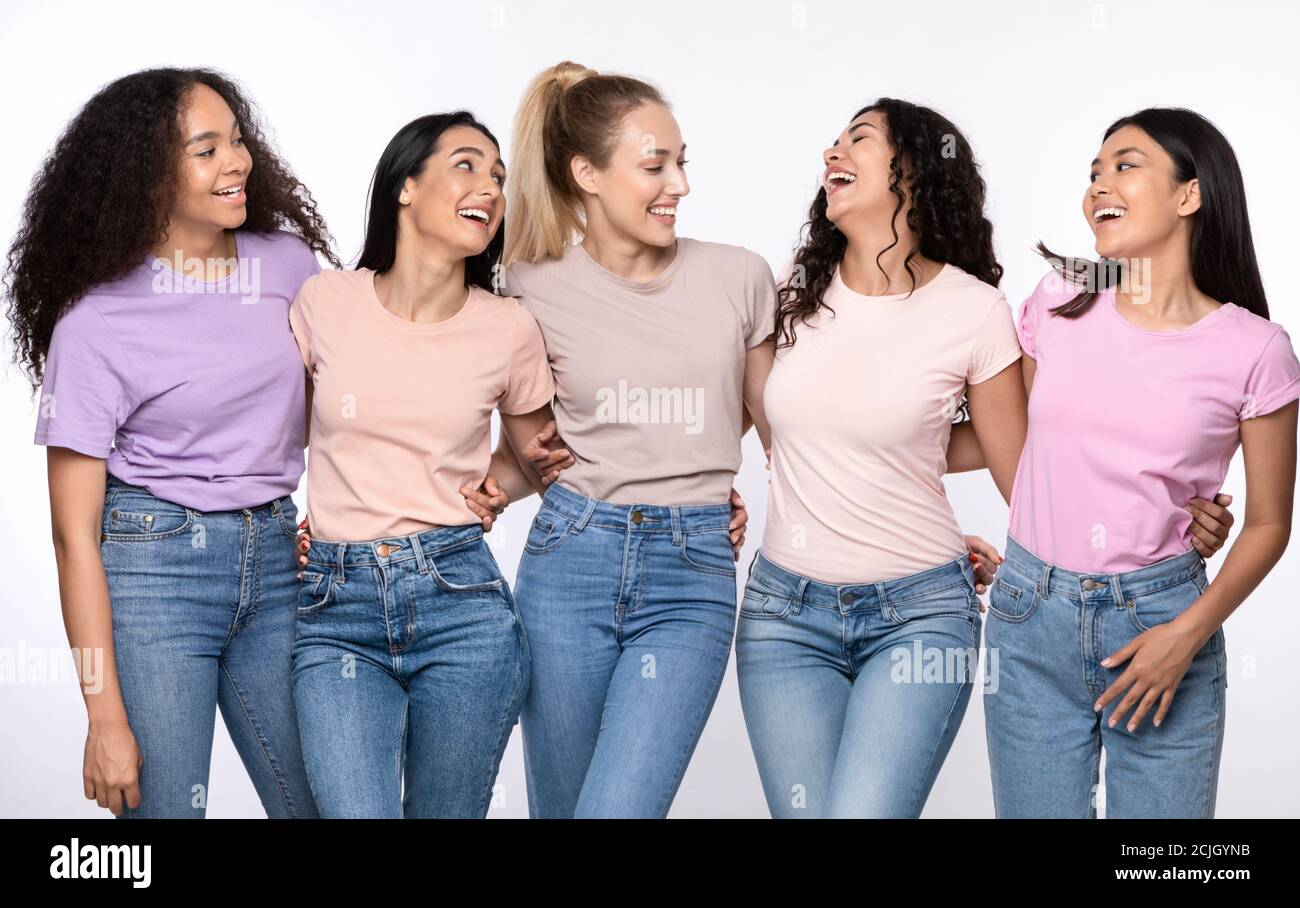 Happy multiethnic women standing together hi-res stock photography and ...