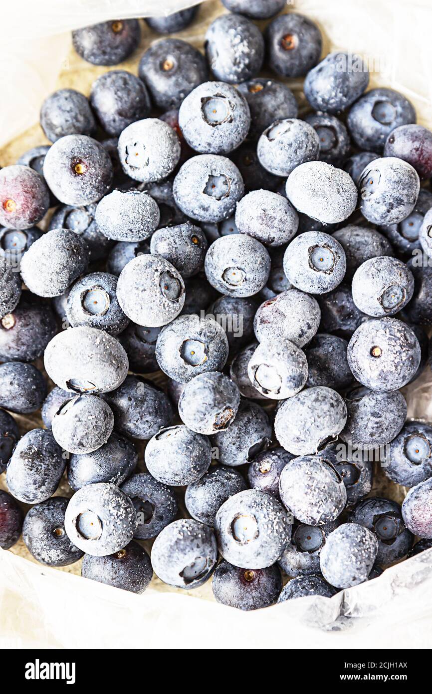 Frozen blueberries in transparent plastic bag. Close up. Concept of ...