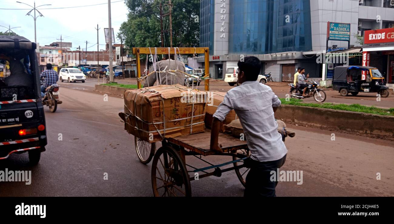 DISTRICT KATNI, INDIA - AUGUST 07, 2019: Indian poor people pushing ...