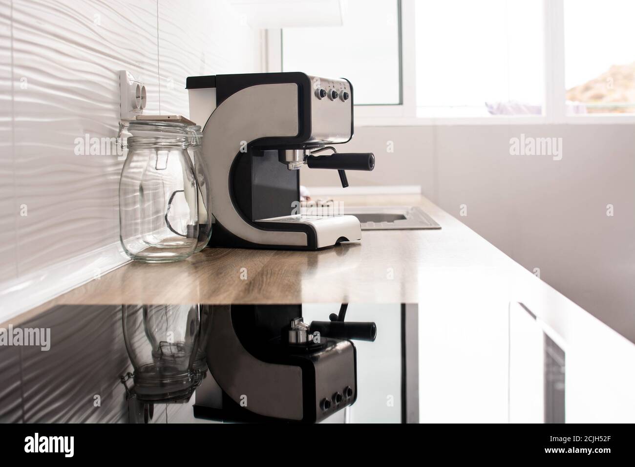 Modern kitchen with coffee machine Stock Photo - Alamy