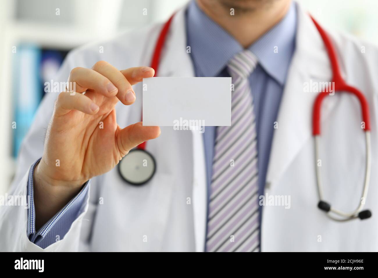 Male medicine doctor hand holding blank calling card Stock Photo - Alamy