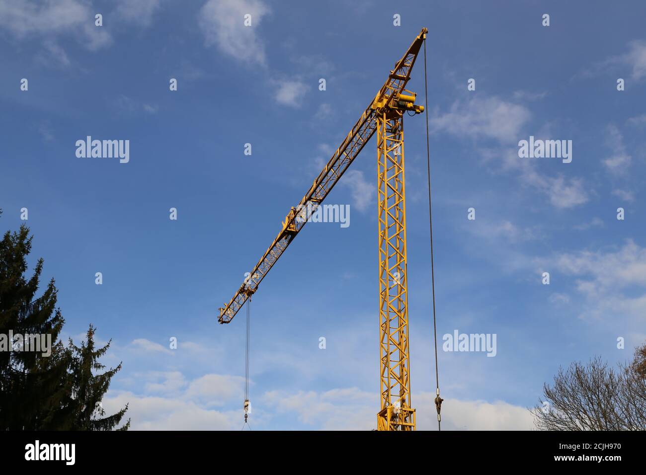 Low angle shot of a crane under the blue sky Stock Photo - Alamy