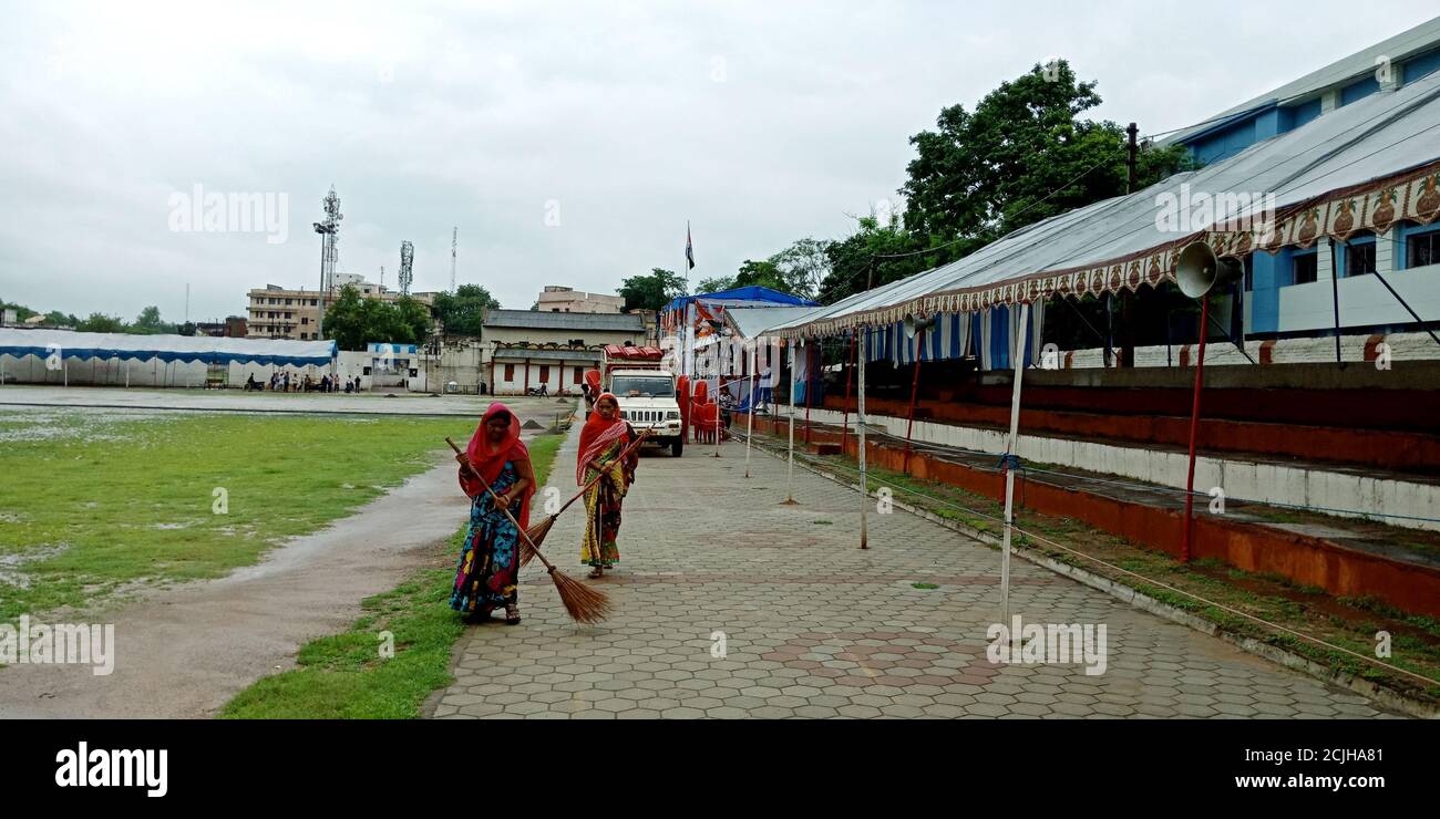 Indian man sweeping road hi-res stock photography and images - Alamy