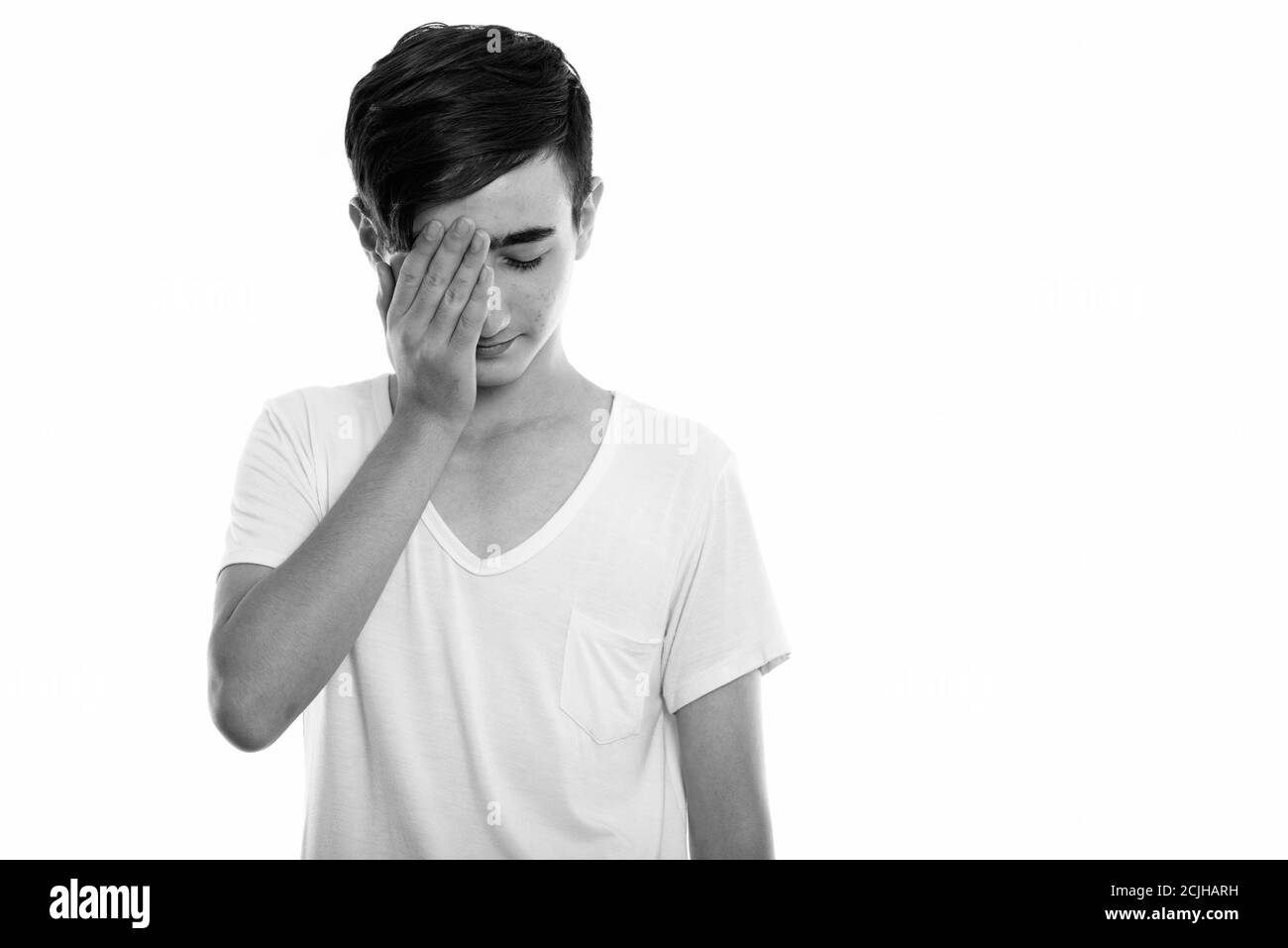 Teen boy covering face hi-res stock photography and images - Alamy