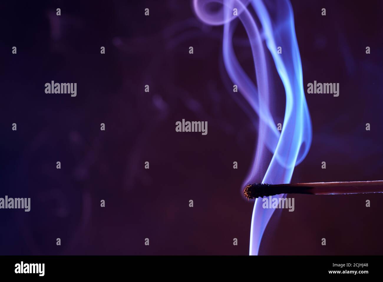 Burning matchstick and a long blue flame Stock Photo - Alamy
