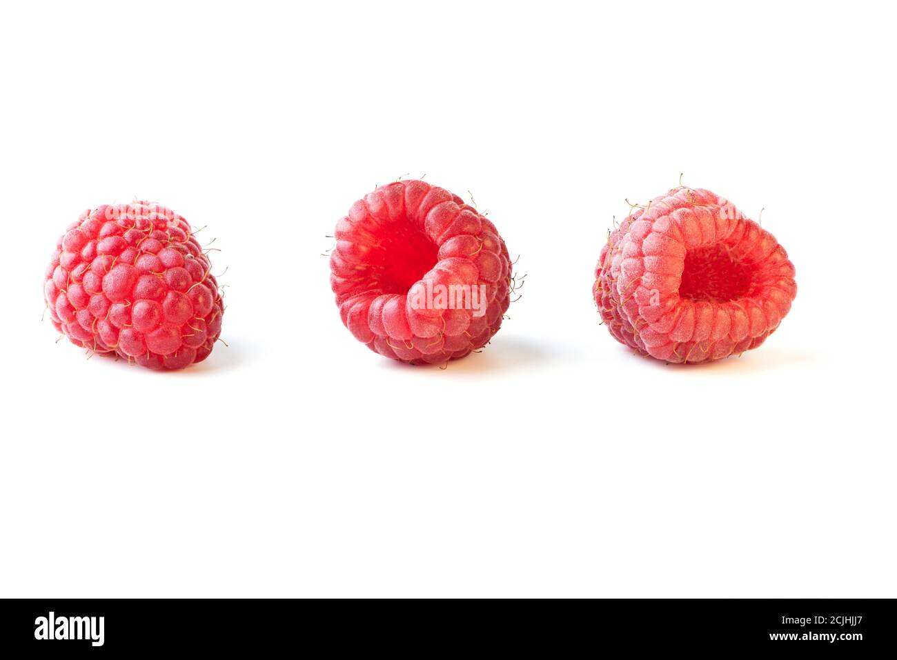 Three ripe raspberry fruits isolated on white background Stock Photo ...