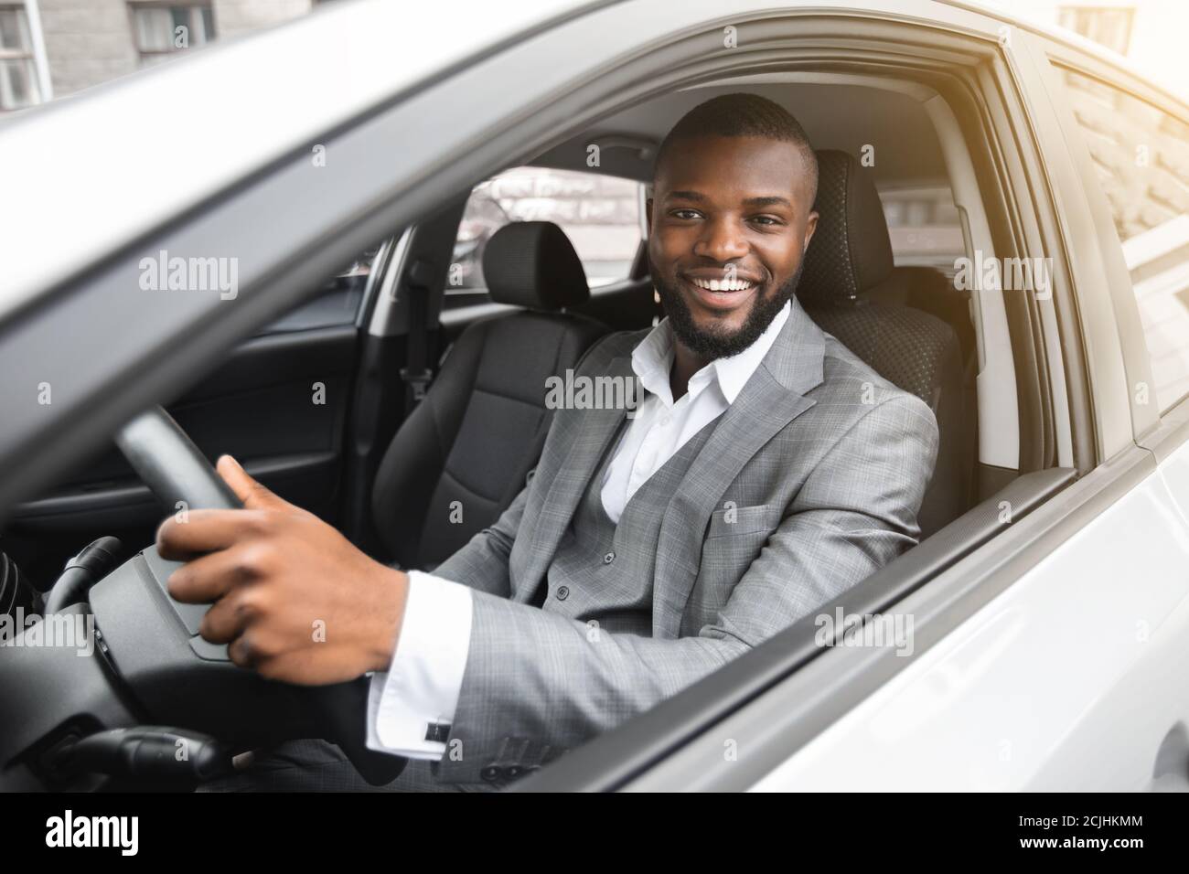 Handsome young black man driving hi-res stock photography and images ...