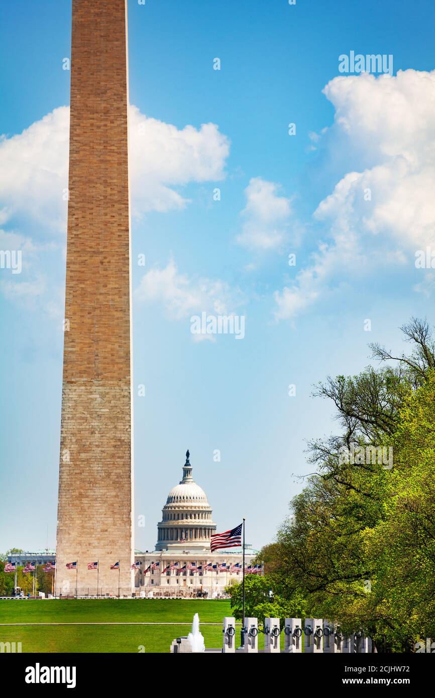 Washington memorial obelisk column over flags, US Capitol building, DC ...