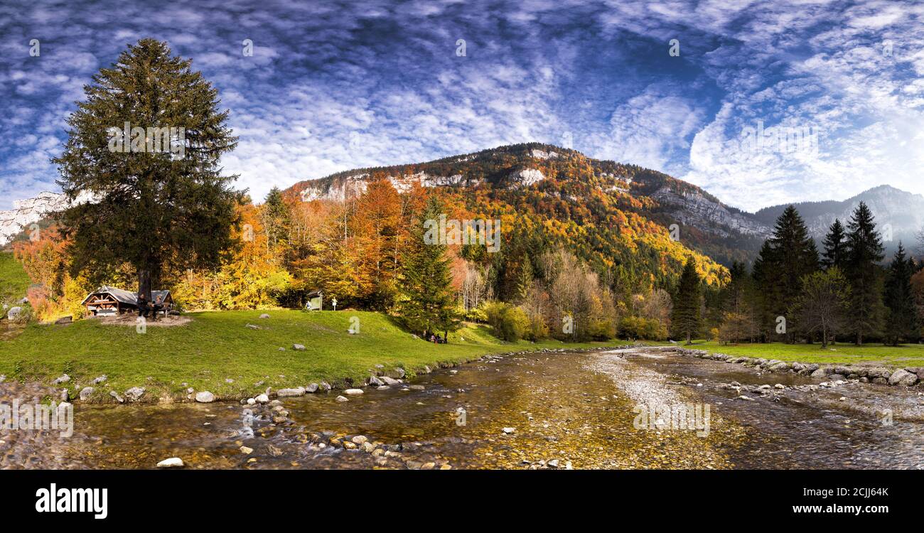 River flowing by the mountains in autumn in the French Alps Stock Photo ...