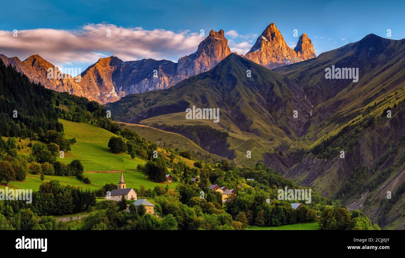 church in a village in the french alps with mountains 3000 meters high ...