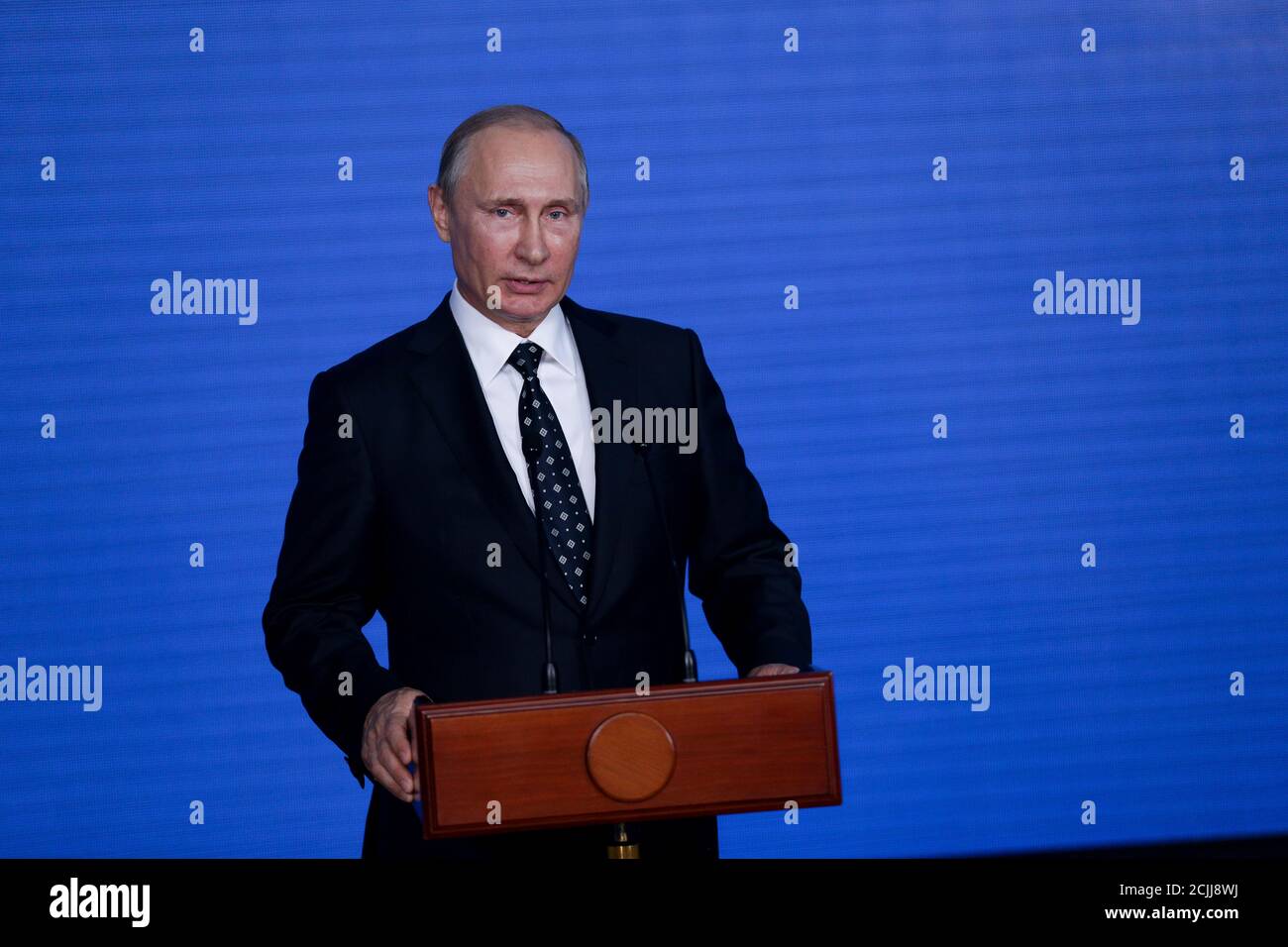 President of the Russian Federation Vladimir Putin stands behind the ...