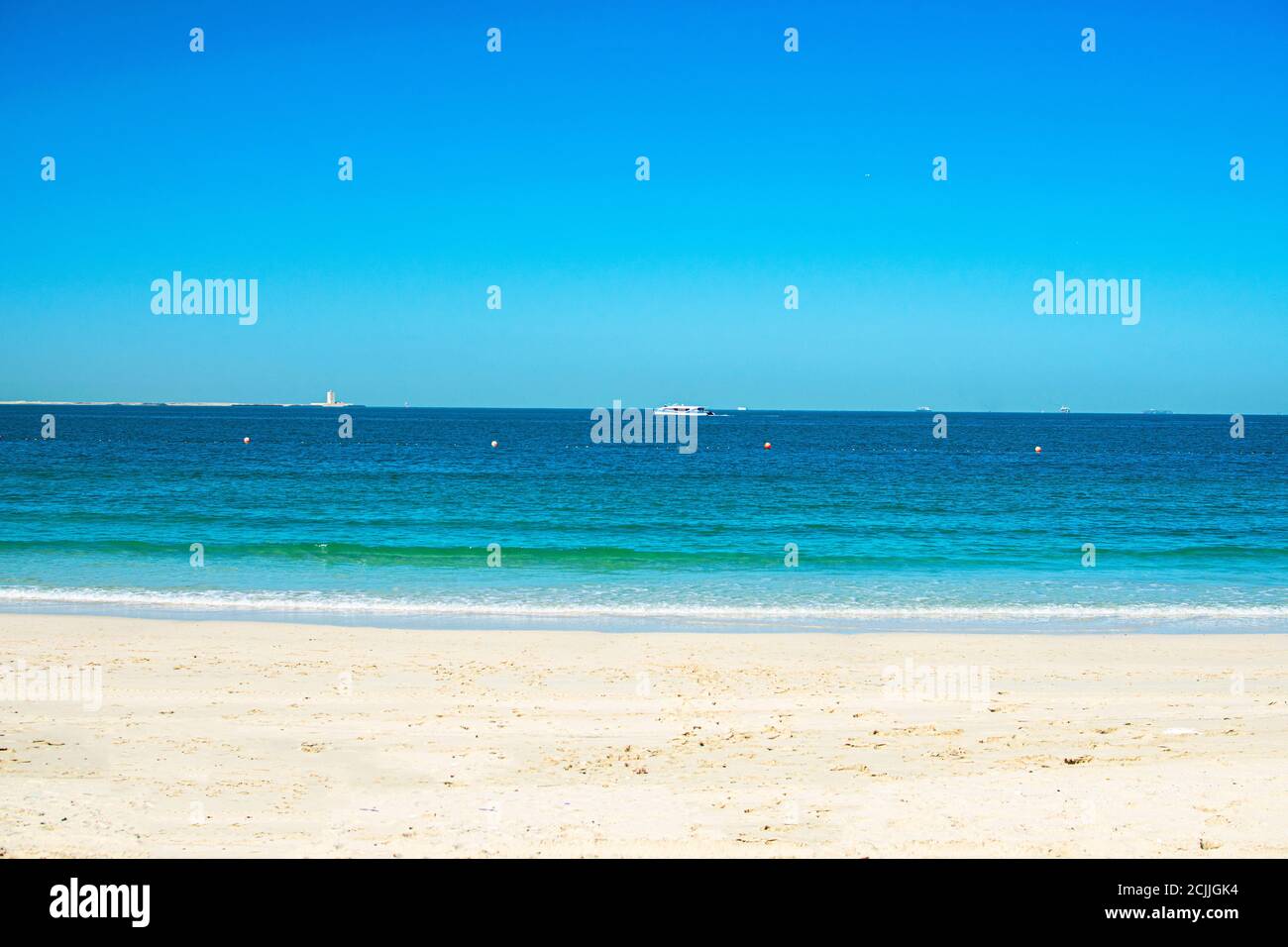 Beautiful public beach with turquoise water in Persian Gulf shoreline ...