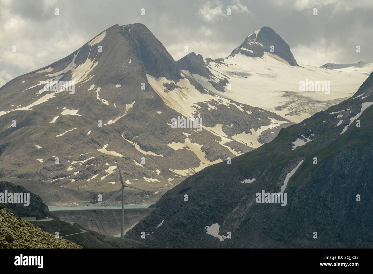 Dam and wind farm on Nufenen pass in the Swiss alps Stock Photo - Alamy