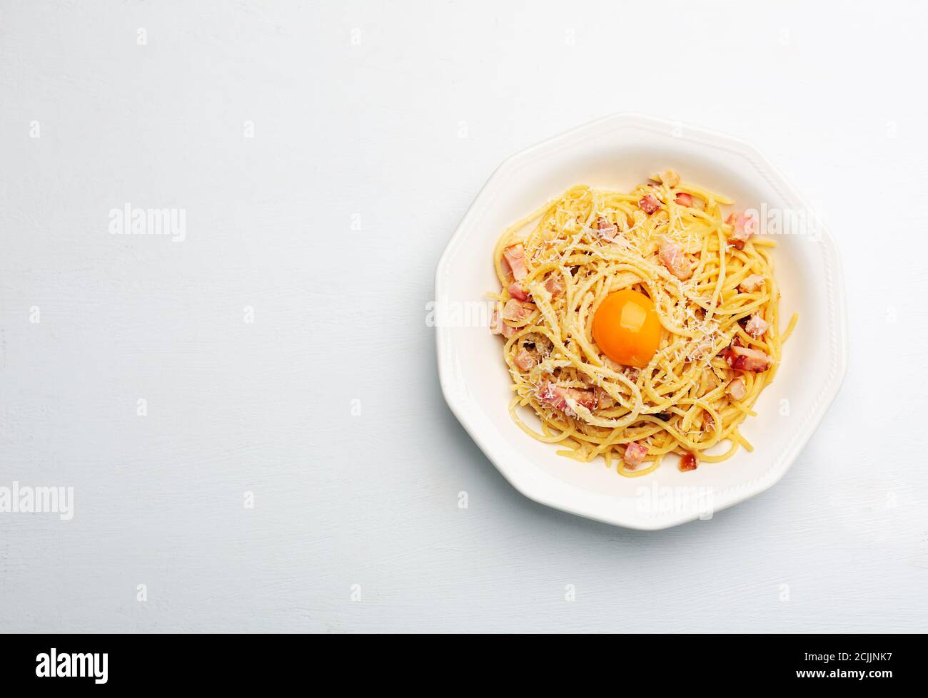 Italian pasta carbonara made with egg, hard cheese, cured pork ...
