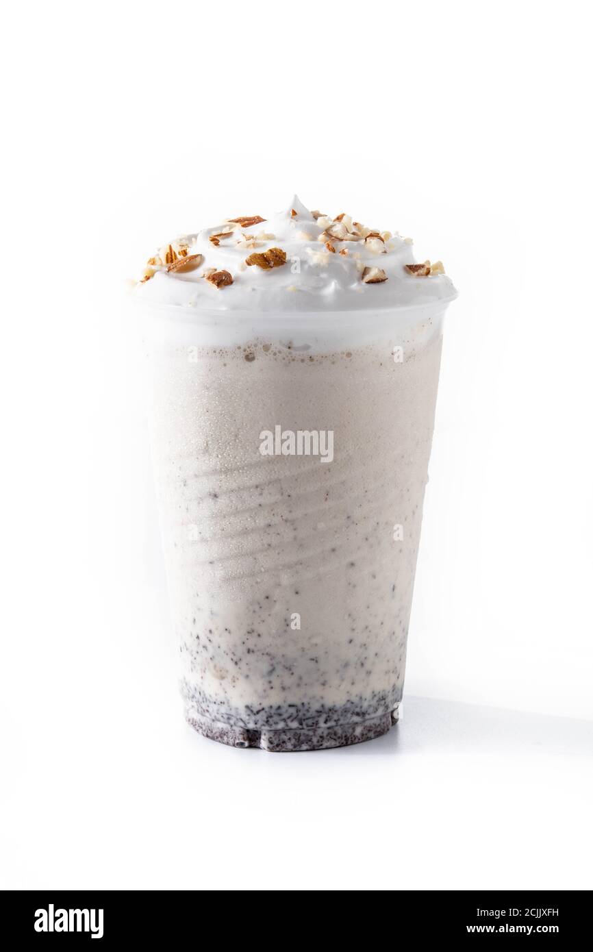 White chocolate, vanilla and nuts iced milkshake isolated on white ...