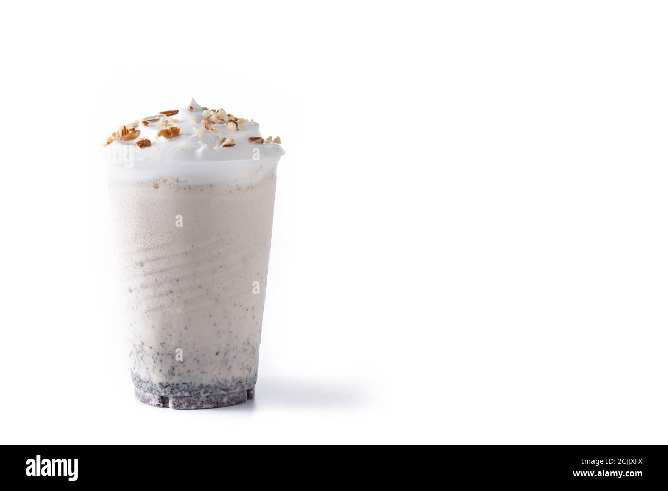 White chocolate, vanilla and nuts iced milkshake isolated on white ...