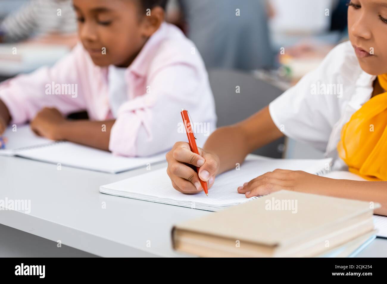 School notebooks on desk hi-res stock photography and images - Alamy