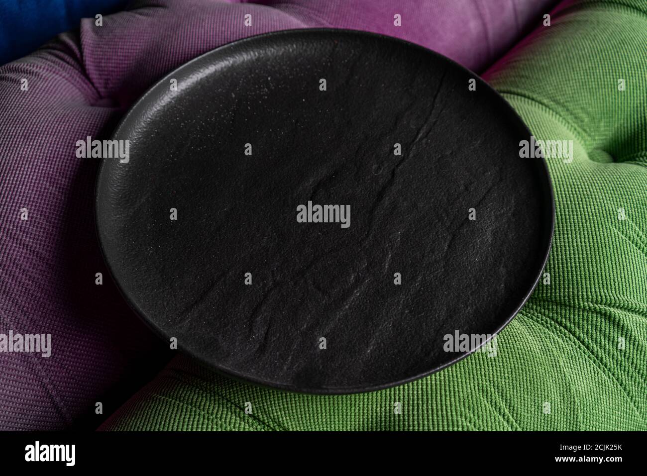 Empty rustic black plates over grunge textured timber, top view Stock ...