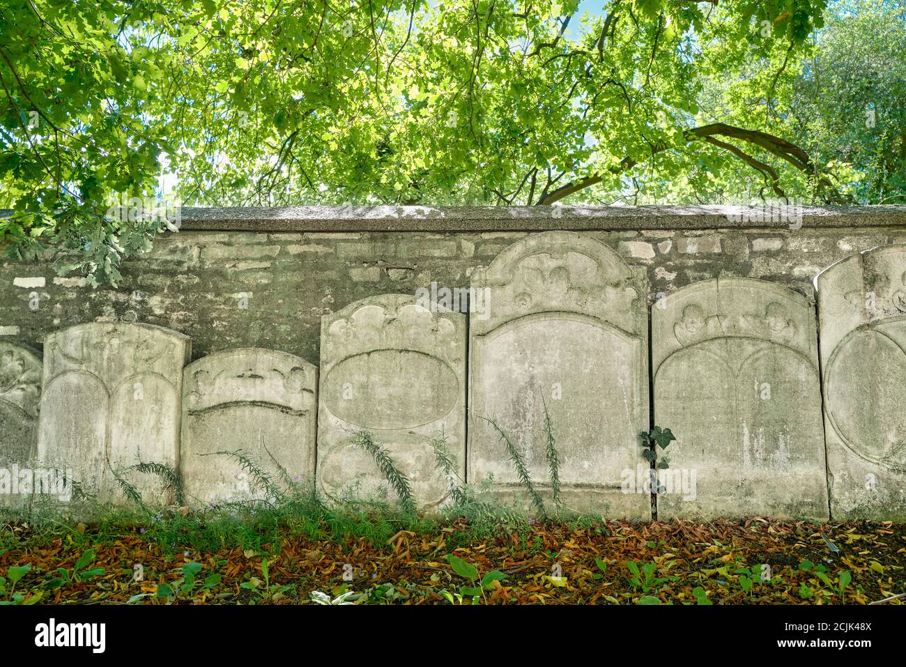Grave stones stacked against a wall in the grounds of Peterborough ...