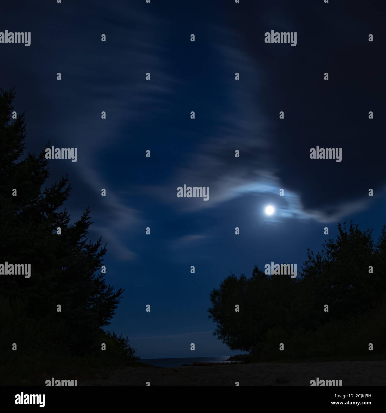 Beautiful scenery of the full moon over a landscape Stock Photo - Alamy
