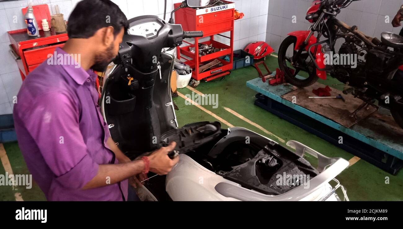 DISTRICT KATNI, INDIA - SEPTEMBER 15, 2019: an asian motorbikes service ...