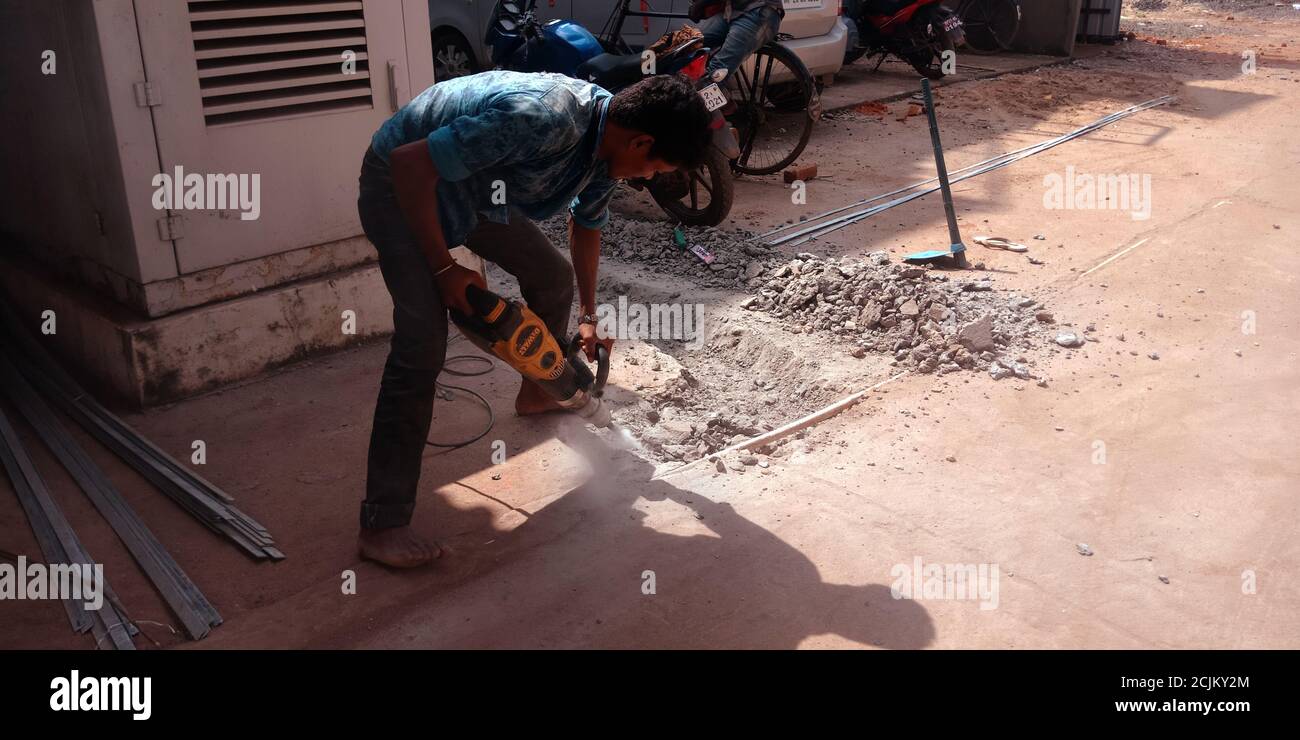 DISTRICT KATNI, INDIA - OCTOBER 06, 2019: Indian construction worker ...