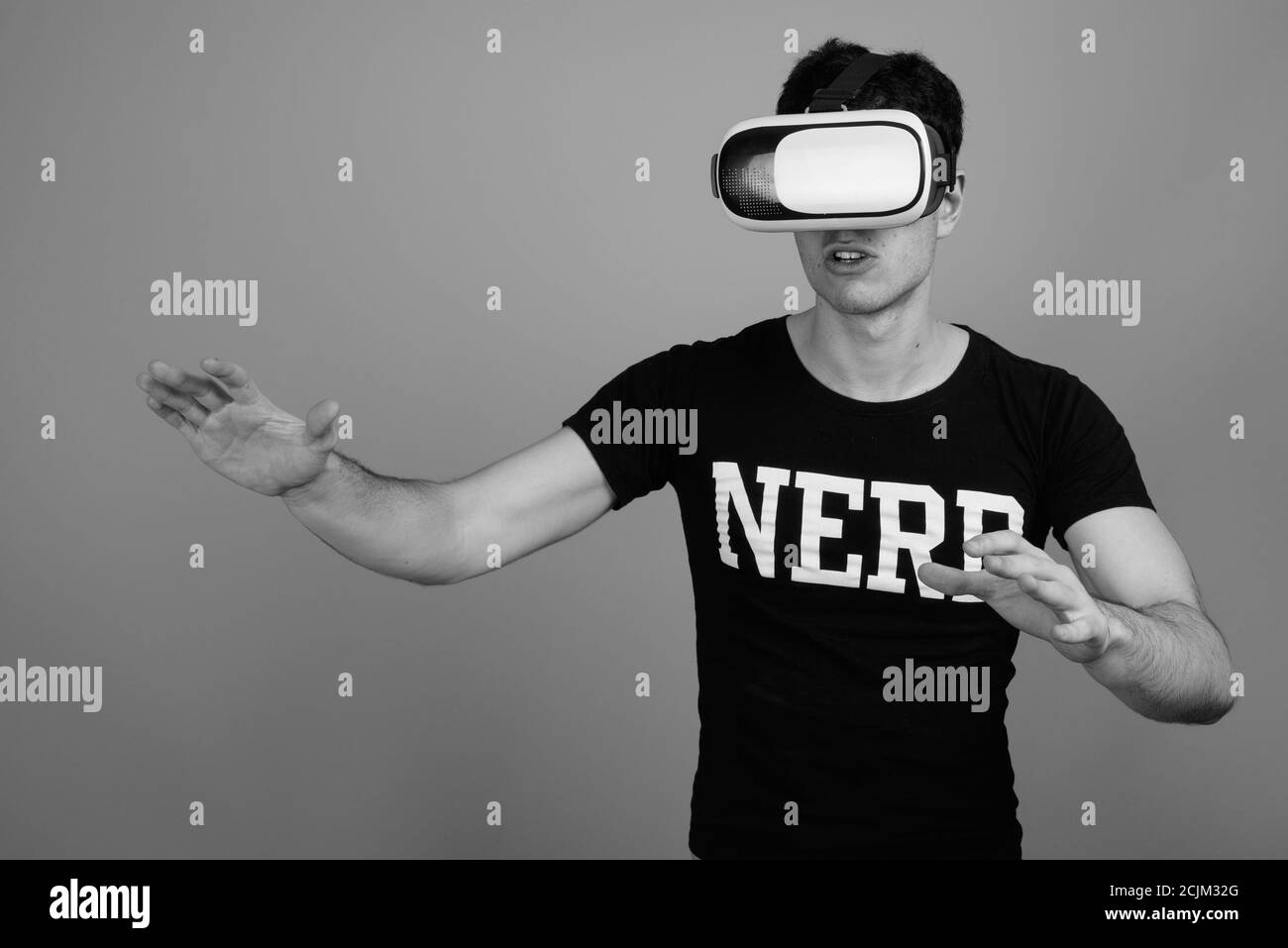 Handsome man wearing vr headset Black and White Stock Photos & Images ...