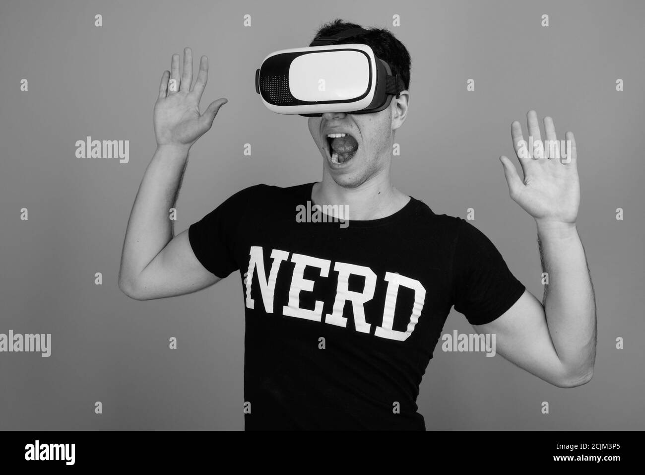 Handsome man wearing vr headset Black and White Stock Photos & Images ...