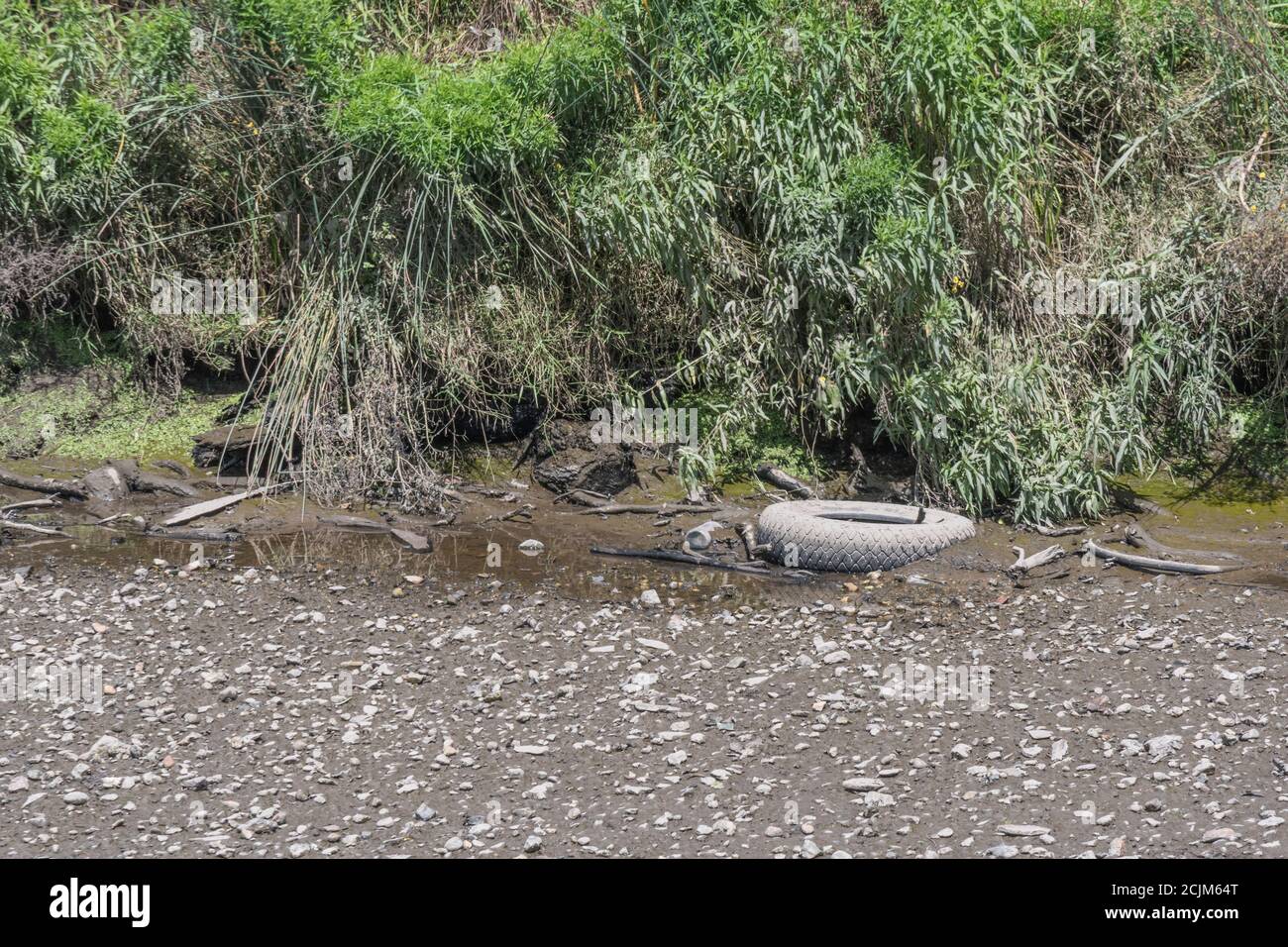 Old tyre in river hi-res stock photography and images - Alamy