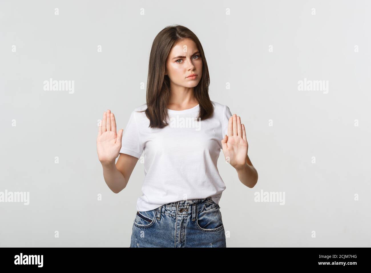 Brunette girl saying stop isolated hi-res stock photography and images ...