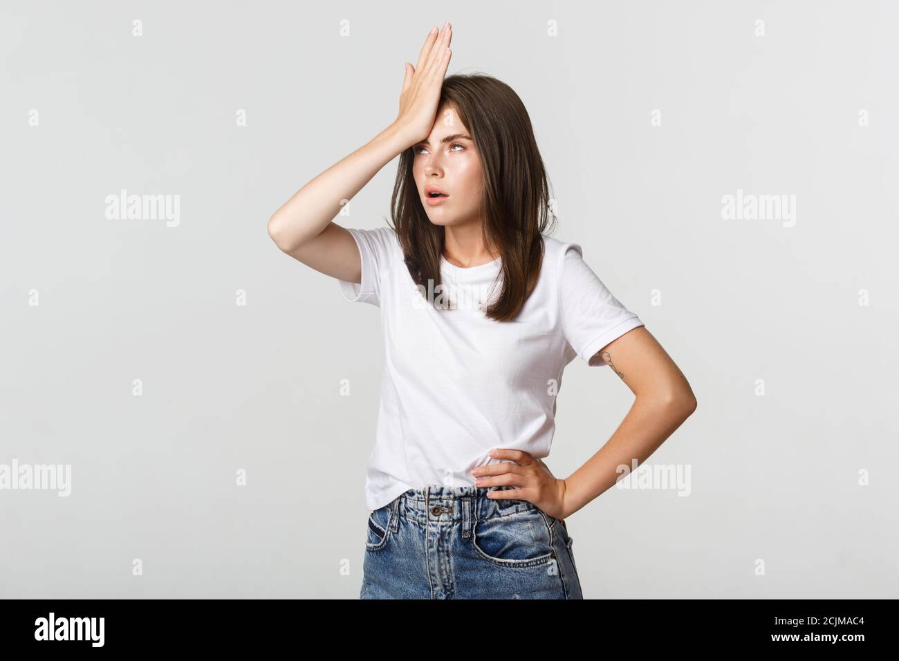 Bothered and annoyed young woman facepalm and roll eyes irritated Stock ...