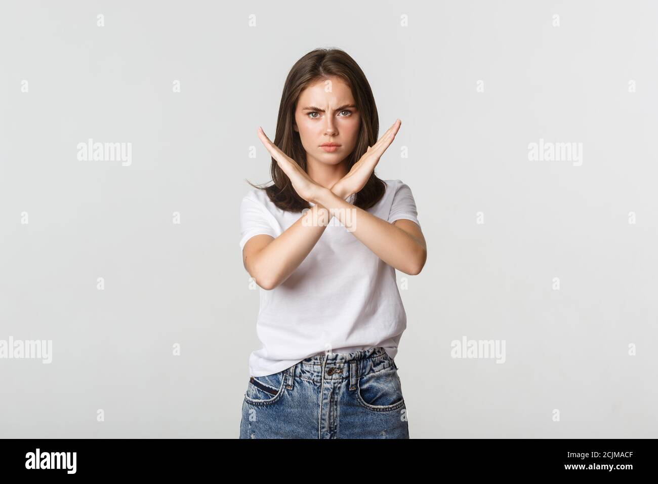 Serious angry woman showing cross, stop something bad, express ...