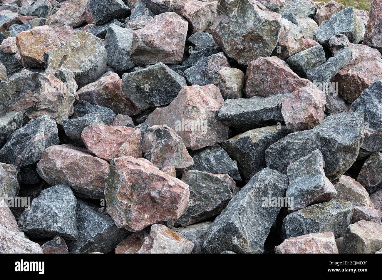 Granite stones of different shapes and colors Stock Photo - Alamy