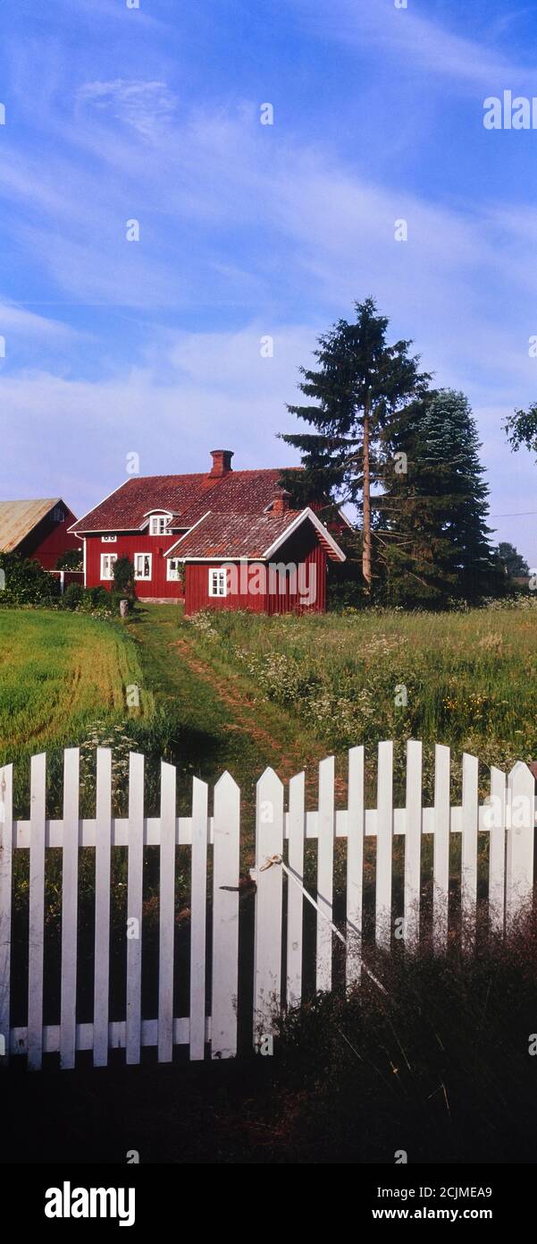 Typical Swedish red coloured farmhouse beside the Gota Canal. Sweden ...