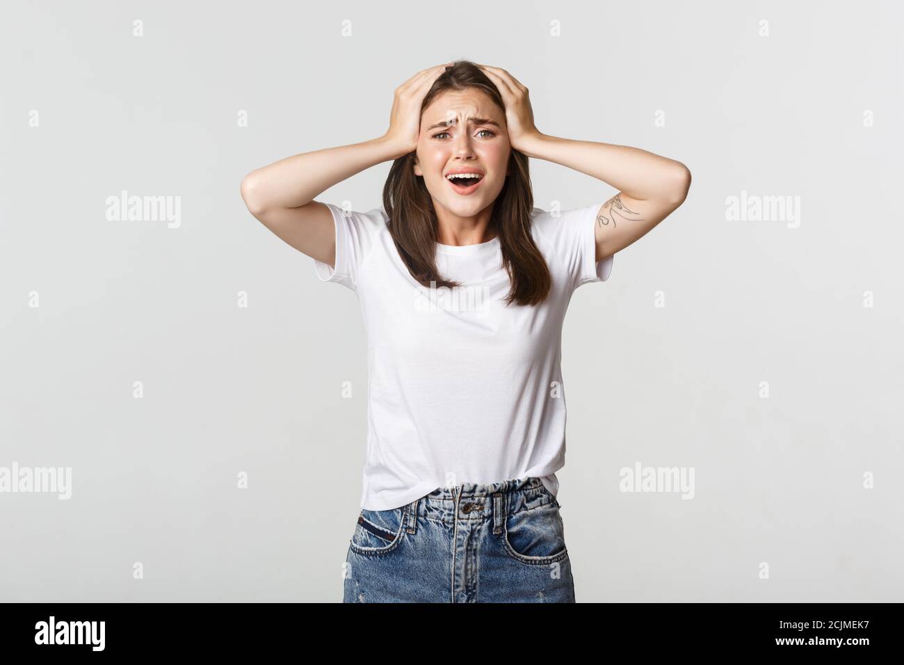 Miserable and shocked young girl panicking, looking alarmed Stock Photo ...