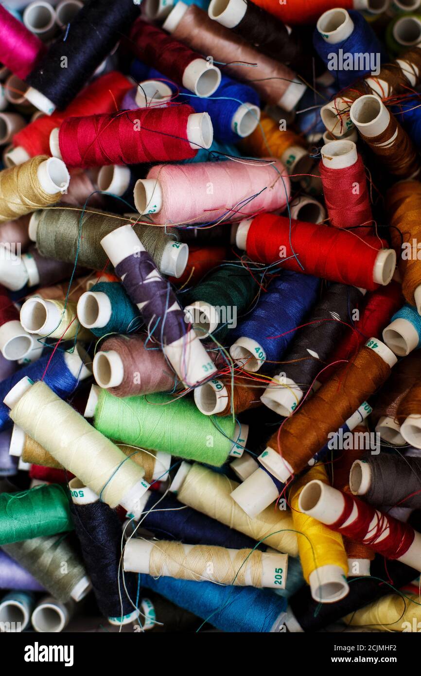 closeup set of skeins of multi-colored sewing thread.Tailor industry ...