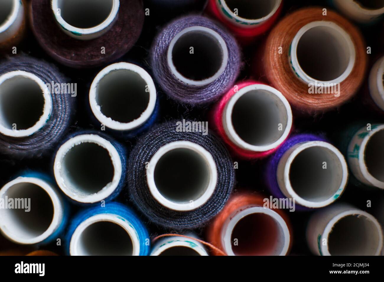 closeup set of skeins of multi-colored sewing thread.Tailor industry ...
