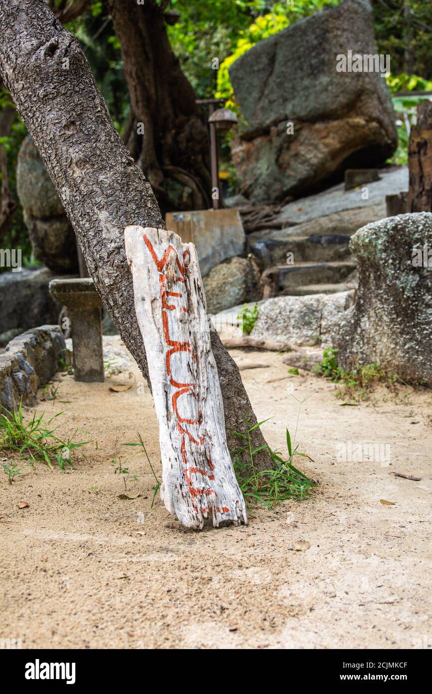 wooden Welcome sign at a resort in Thailand Ko Phangan Stock Photo - Alamy