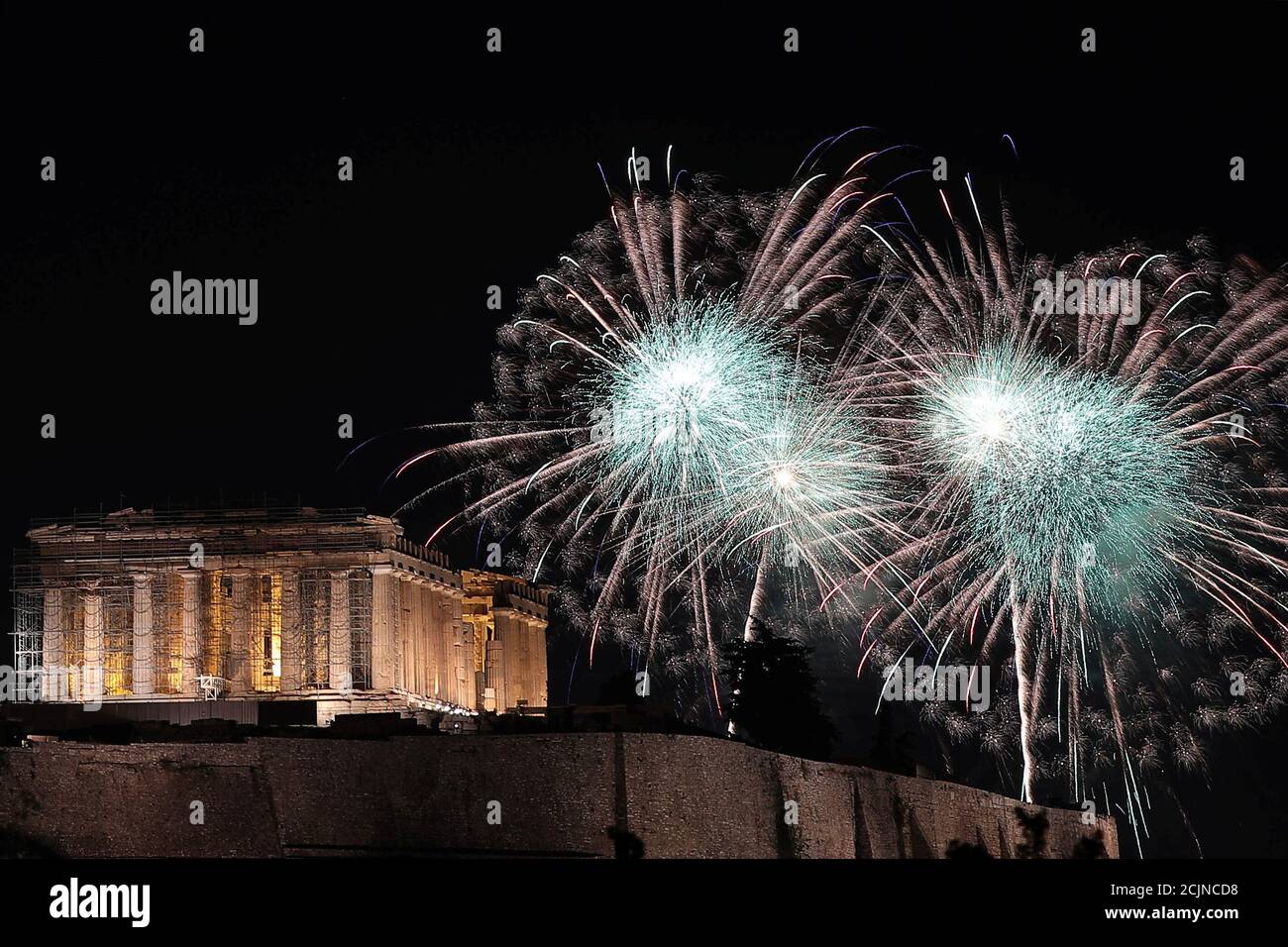 Fireworks explode over the ancient parthenon temple at the acropolis hi ...
